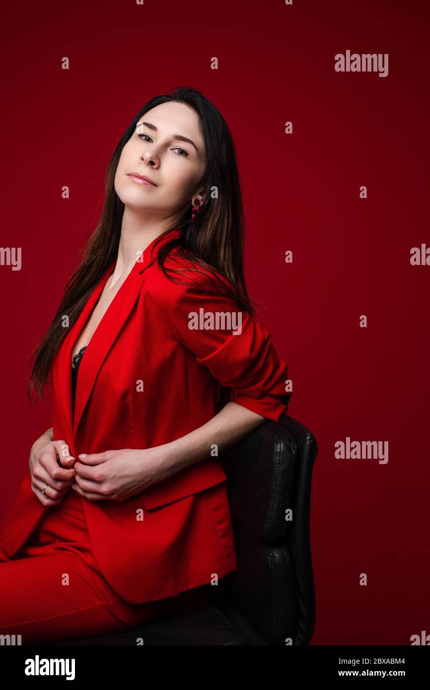 Confident beautiful woman in red jacket. Copy space Stock Photo - Alamy