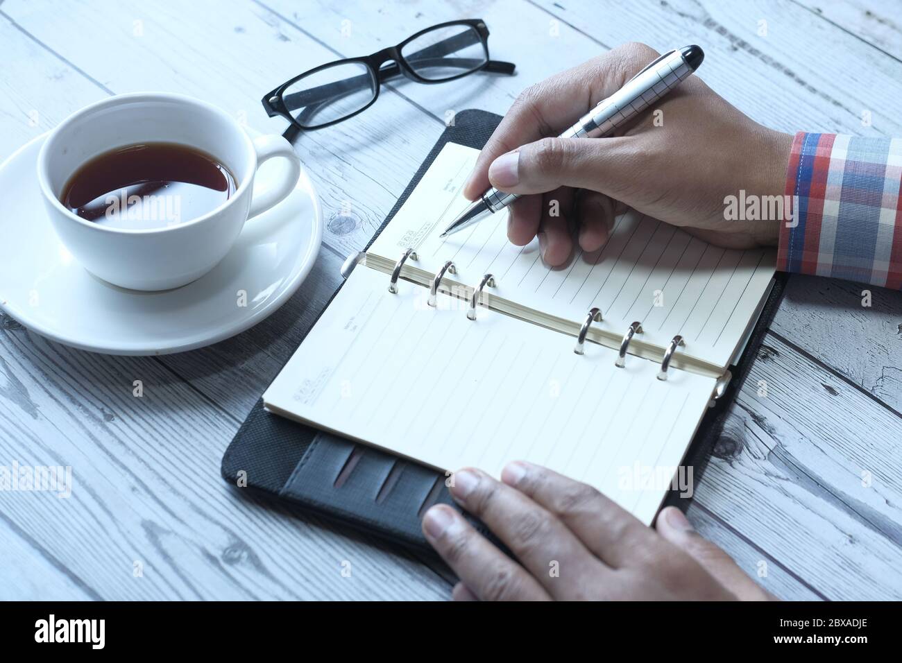 Busy holding laptop notepad hi-res stock photography and images - Alamy