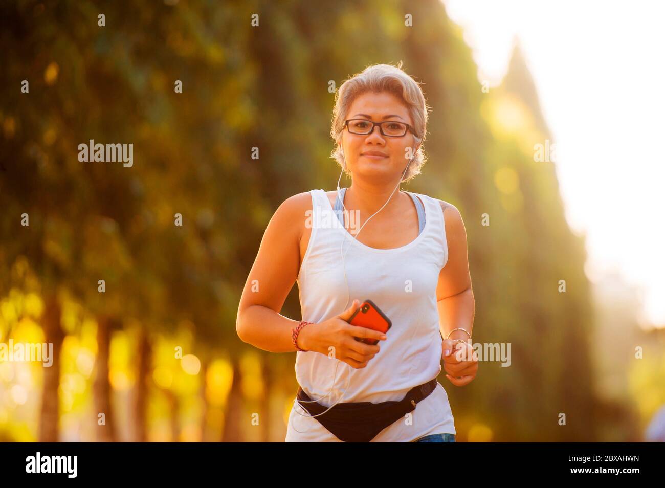 middle aged 40s or 50s happy and attractive woman with grey hair ...