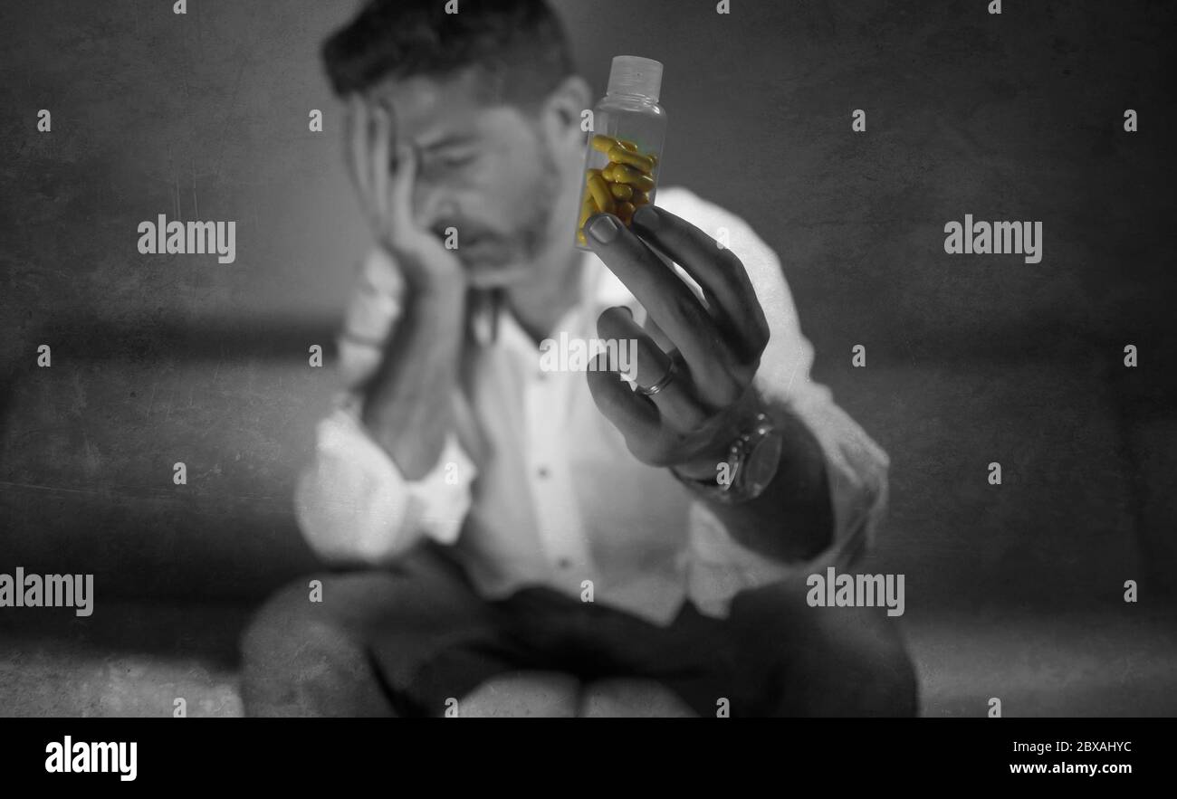 dramatic portrait of young attractive depressed and wasted pills addict ...