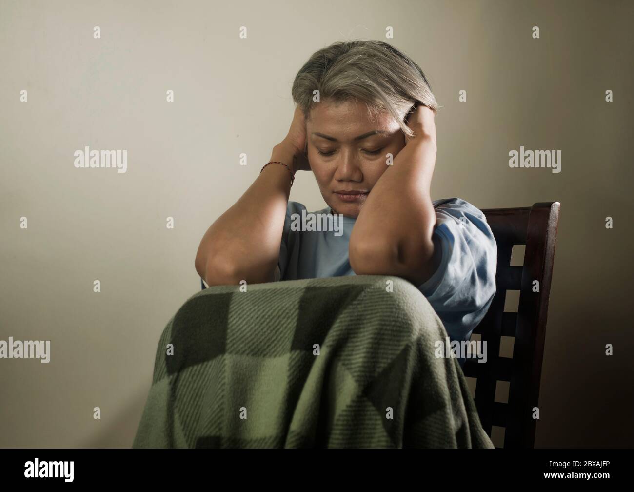 dramatic portrait of attractive sad and depressed mature woman with ...