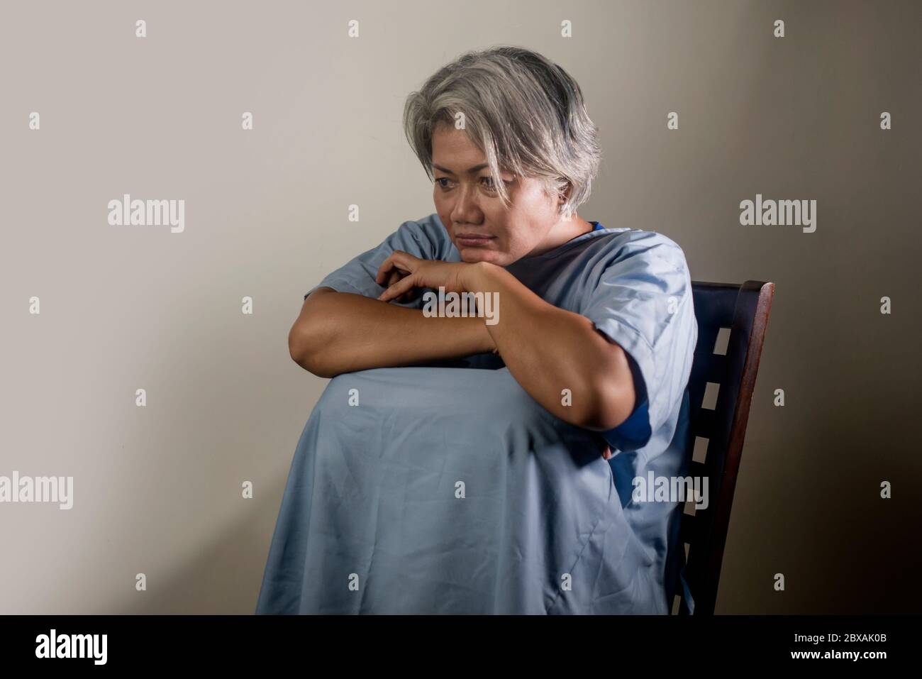 dramatic portrait of attractive sad and depressed mature woman with ...