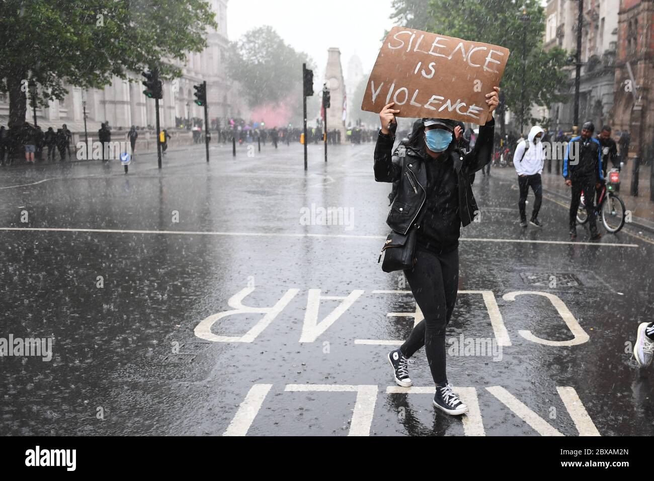 People take part in a Black Lives Matter protest rally on Whitehall ...