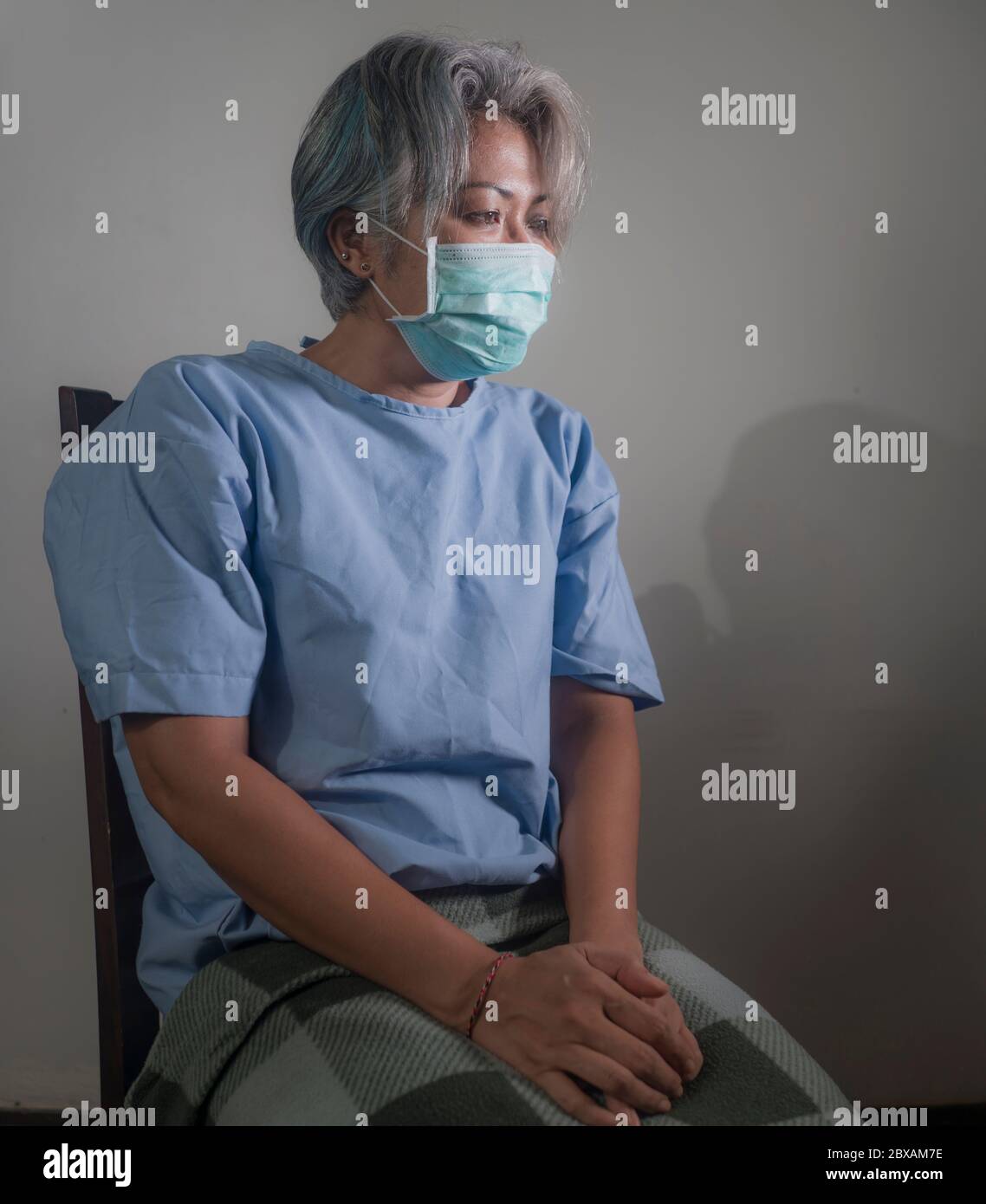 Hispanic woman in hospital gown hi-res stock photography and images - Alamy