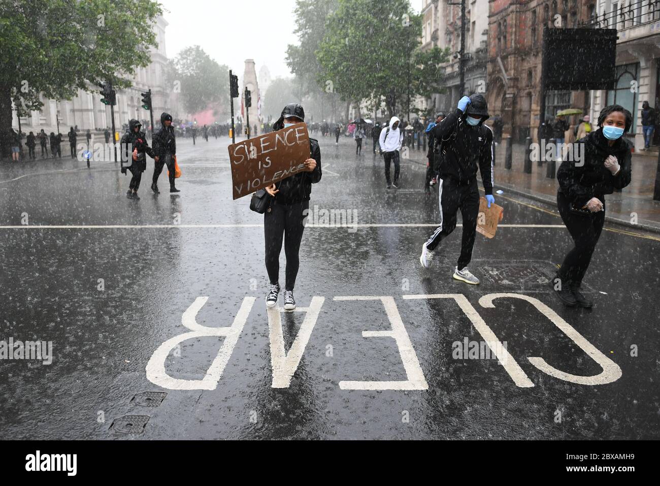 People take part in a Black Lives Matter protest rally on Whitehall ...