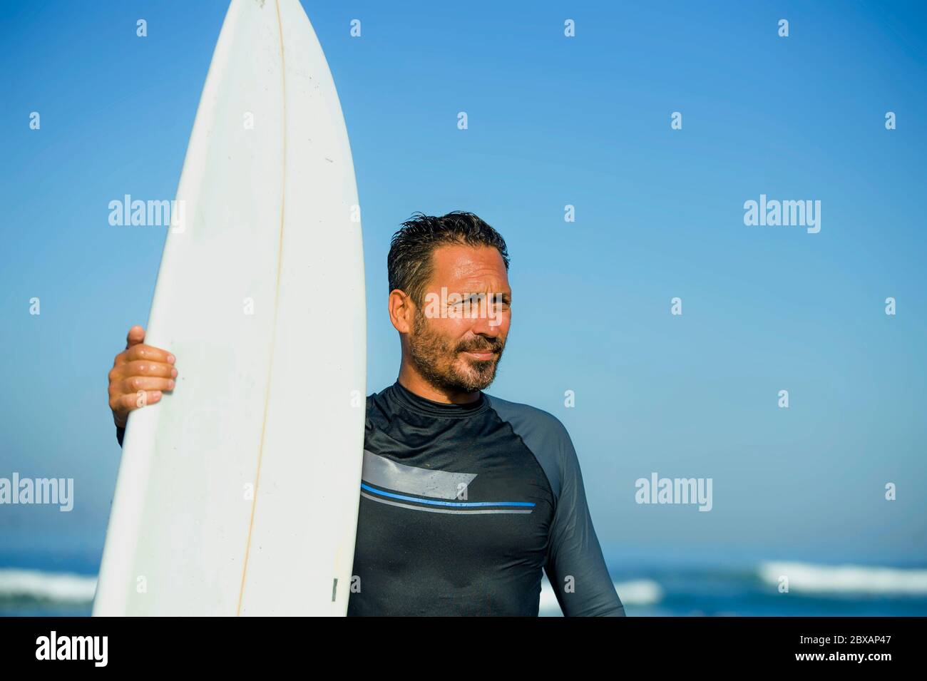 lifestyle portrait of attractive and cool surfer man 3os to 40s in ...