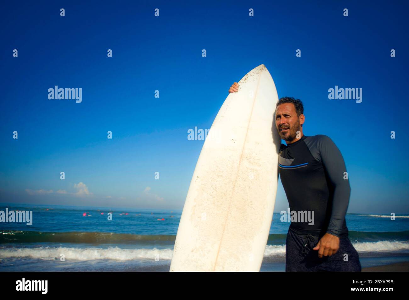 lifestyle portrait of attractive and cool surfer man 3os to 40s in ...