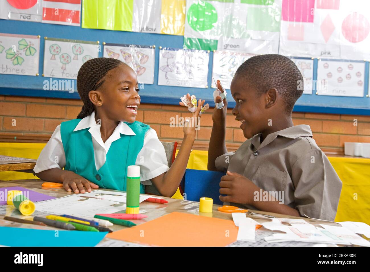 Children making finger puppets in school Stock Photo - Alamy