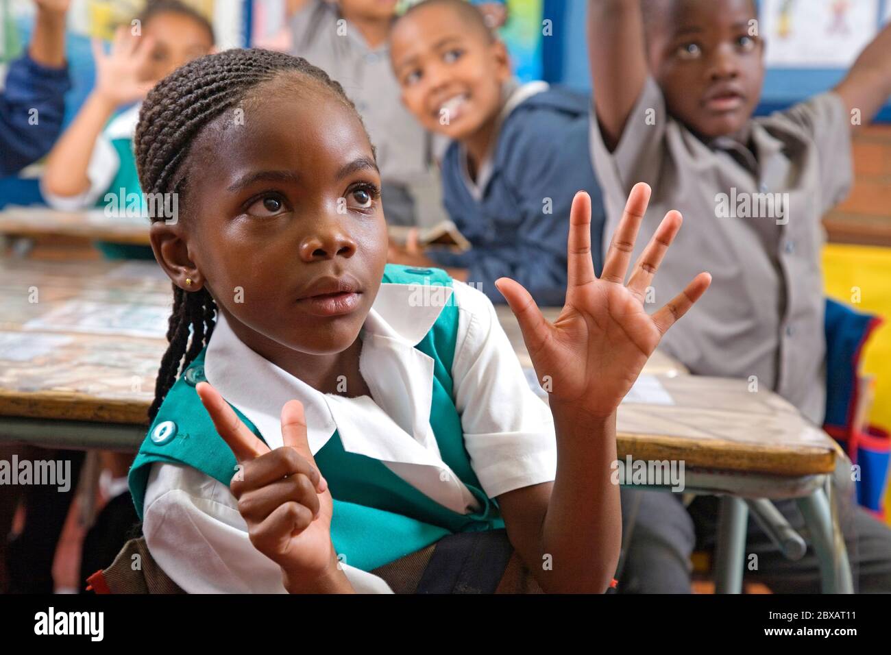 School children counting with fingers hi-res stock photography and ...