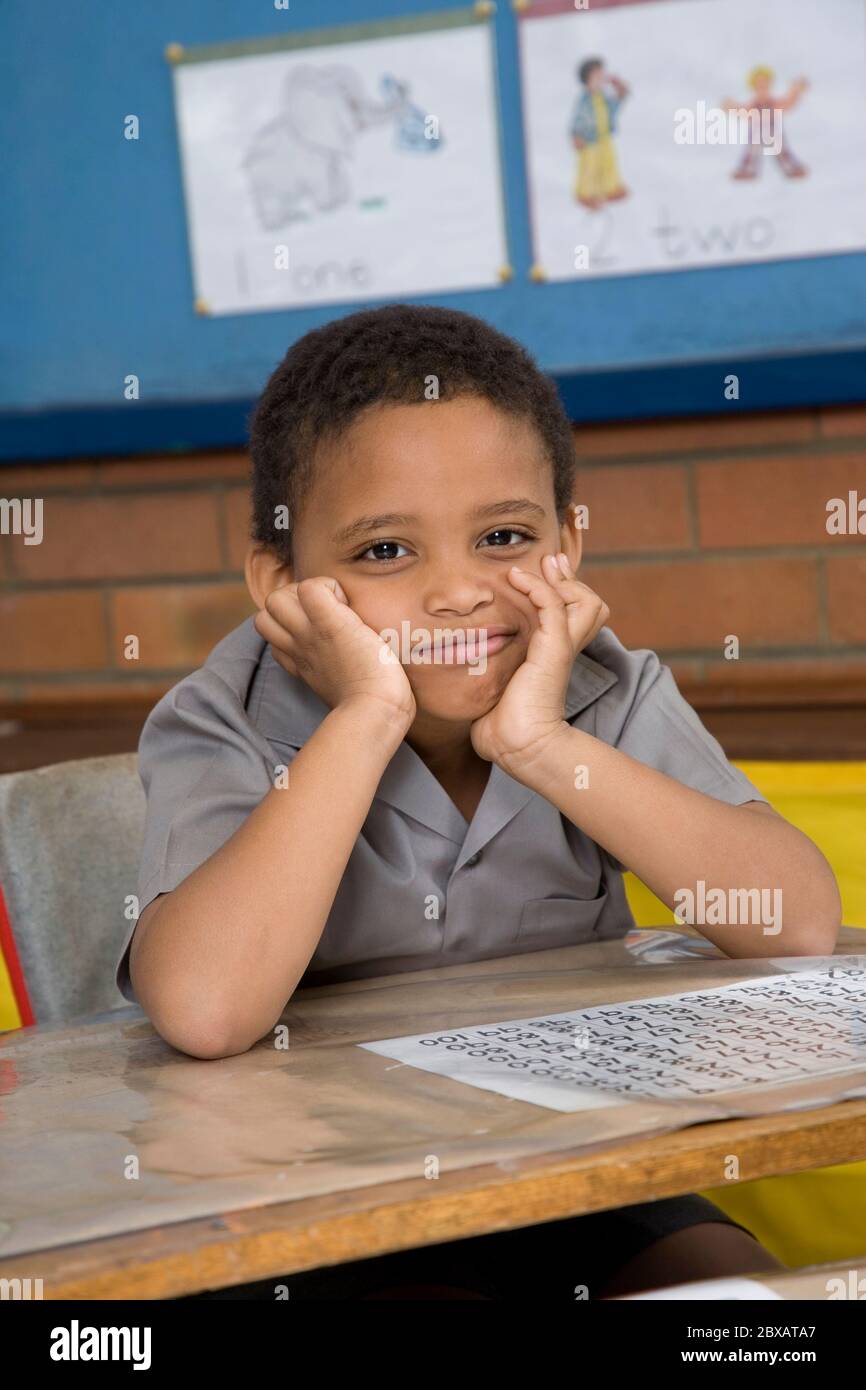 Boy in classroom, bored Stock Photo - Alamy