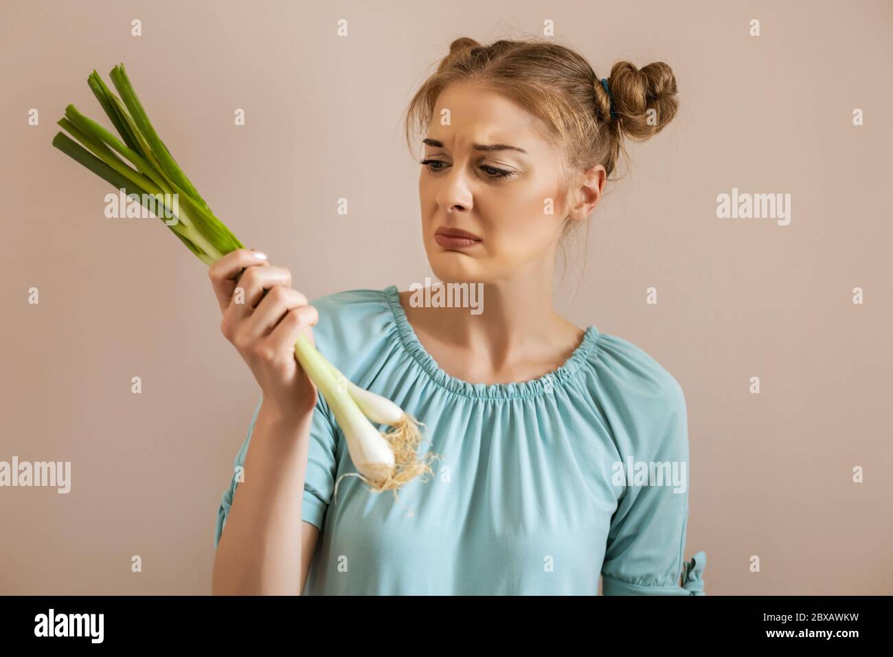 Woman smelling onion hi-res stock photography and images - Alamy