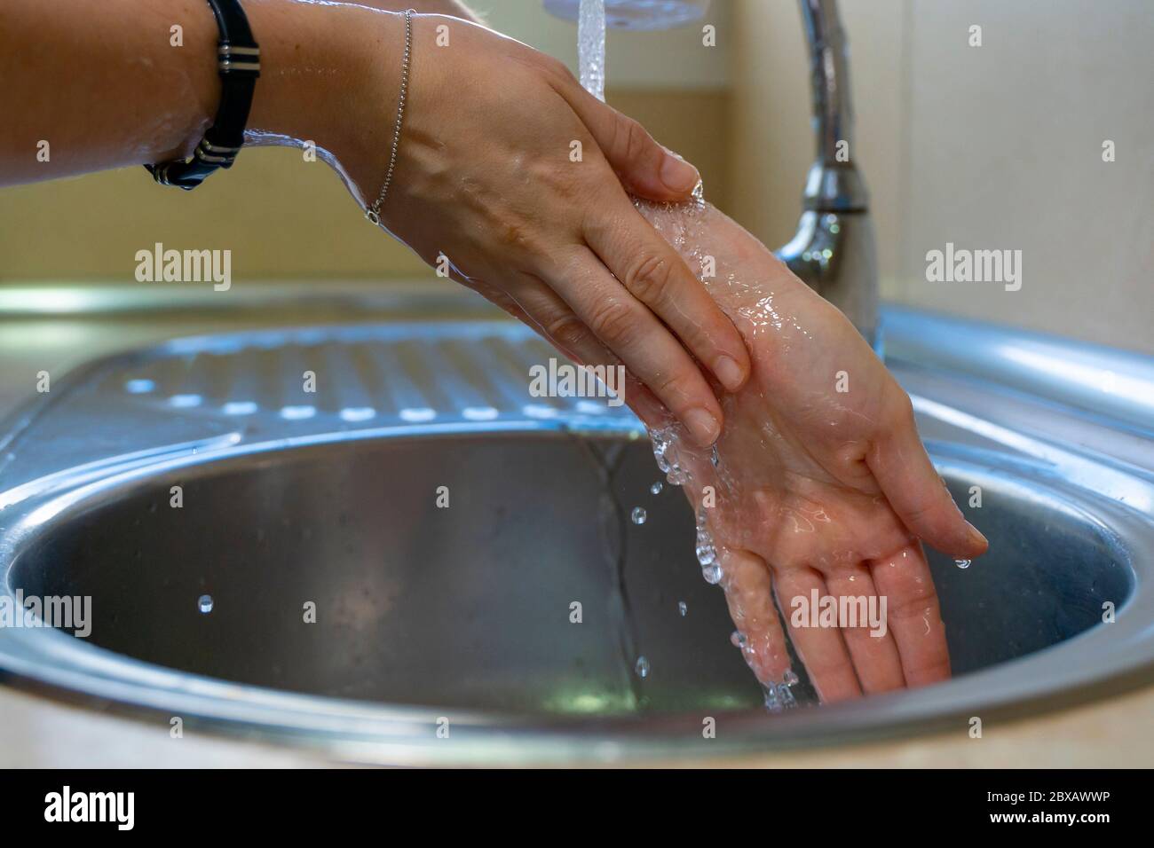 Washing hands properly. Hygiene concept. Rubbing palms with water Stock ...