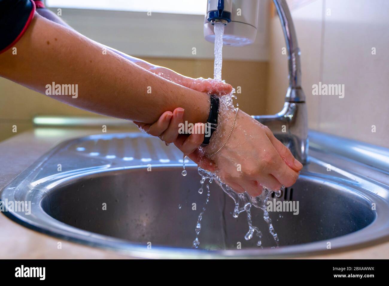 Washing wrist, arms and hands properly. Hygiene concept. Rubbing with ...
