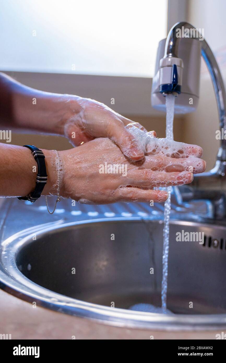 Washing hands properly. Hygiene concept. Rubbing base of the thumbs ...