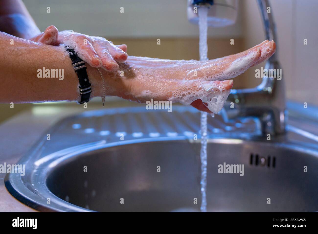 Washing arms with soap hi-res stock photography and images - Alamy