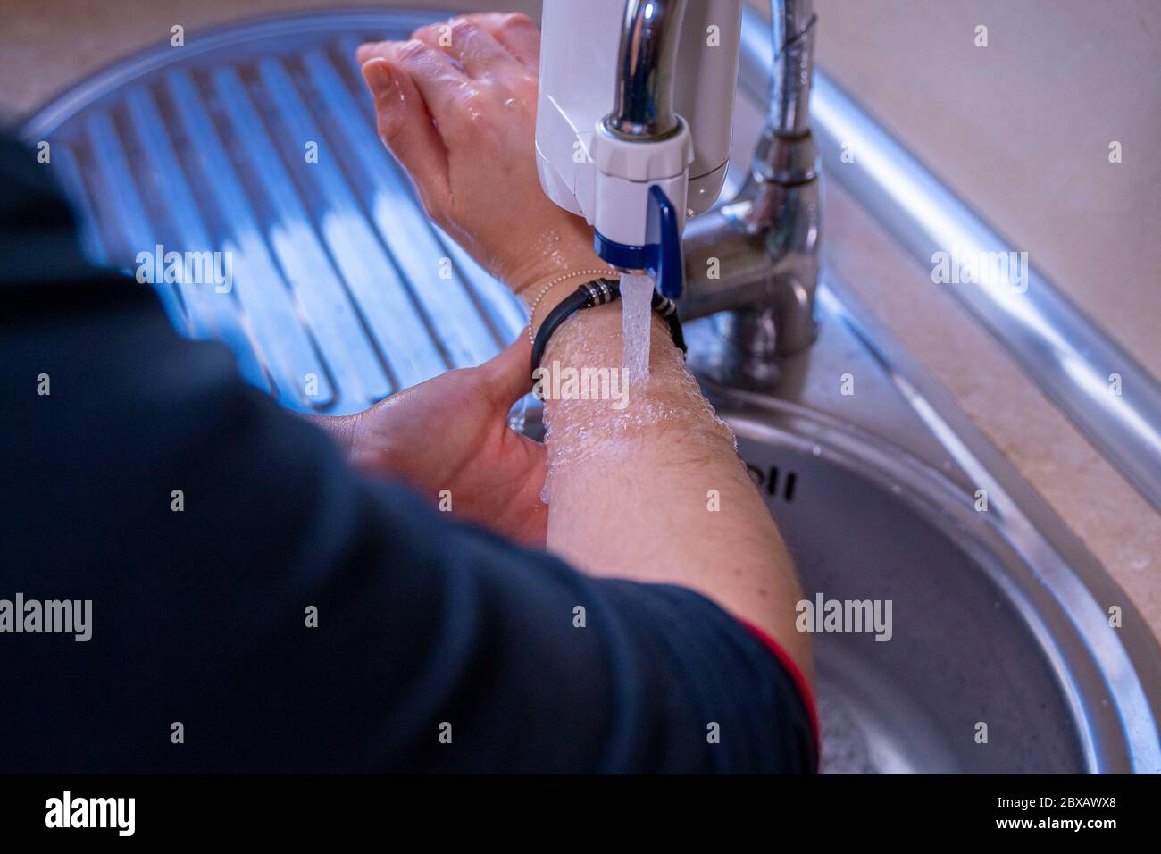 Washing arms properly. Hygiene concept. Wet hands Stock Photo - Alamy