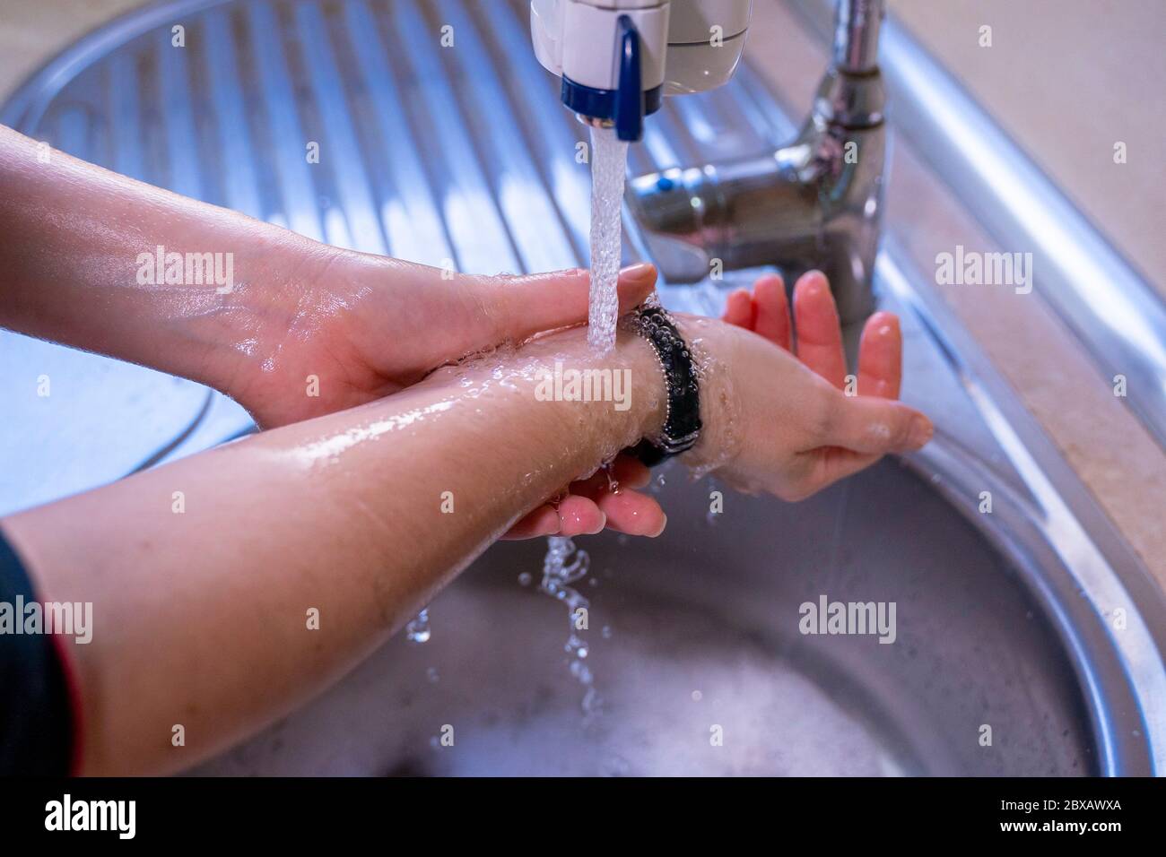 Washing arms and wrist properly. Hygiene concept. Wet hands Stock Photo ...