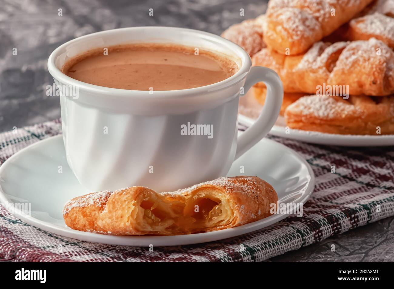 Coffee with cream and freshly baked puffs on a gray background Stock ...
