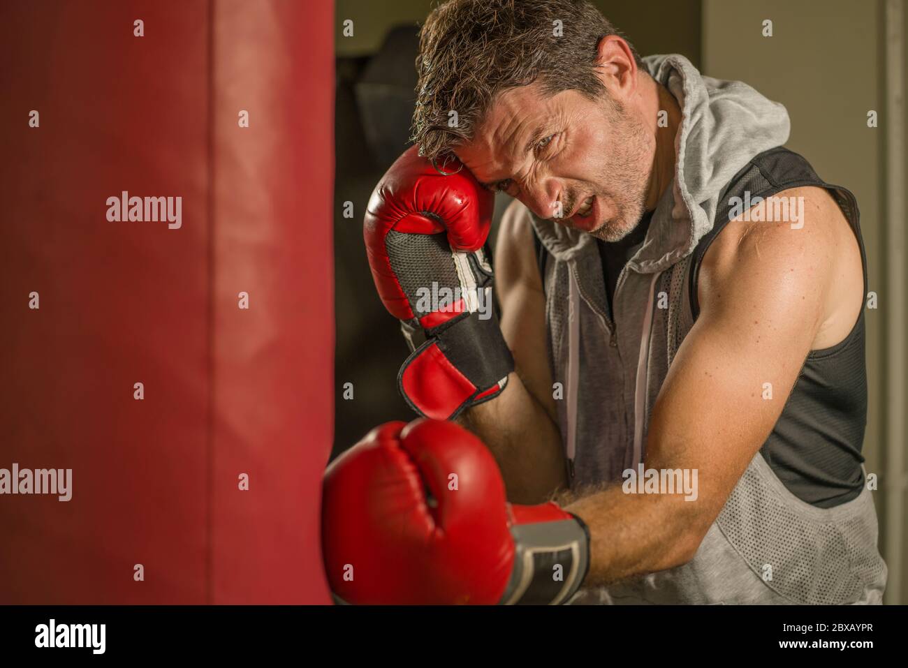 lifestyle gym workout portrait of attractive and fierce looking boxer ...