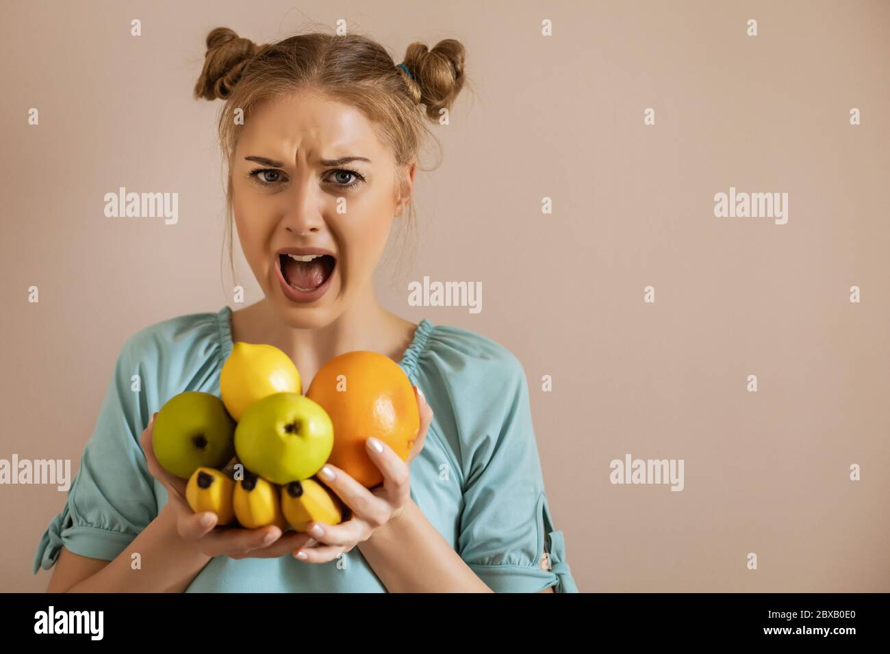 Angry woman shouting because she is tired of dieting.Toned image Stock ...
