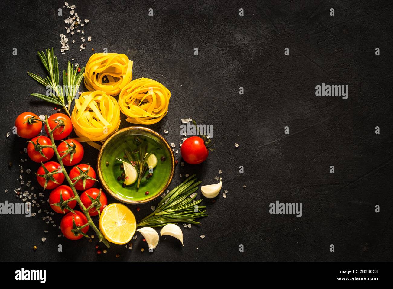 Food cooking background at black table top view Stock Photo - Alamy