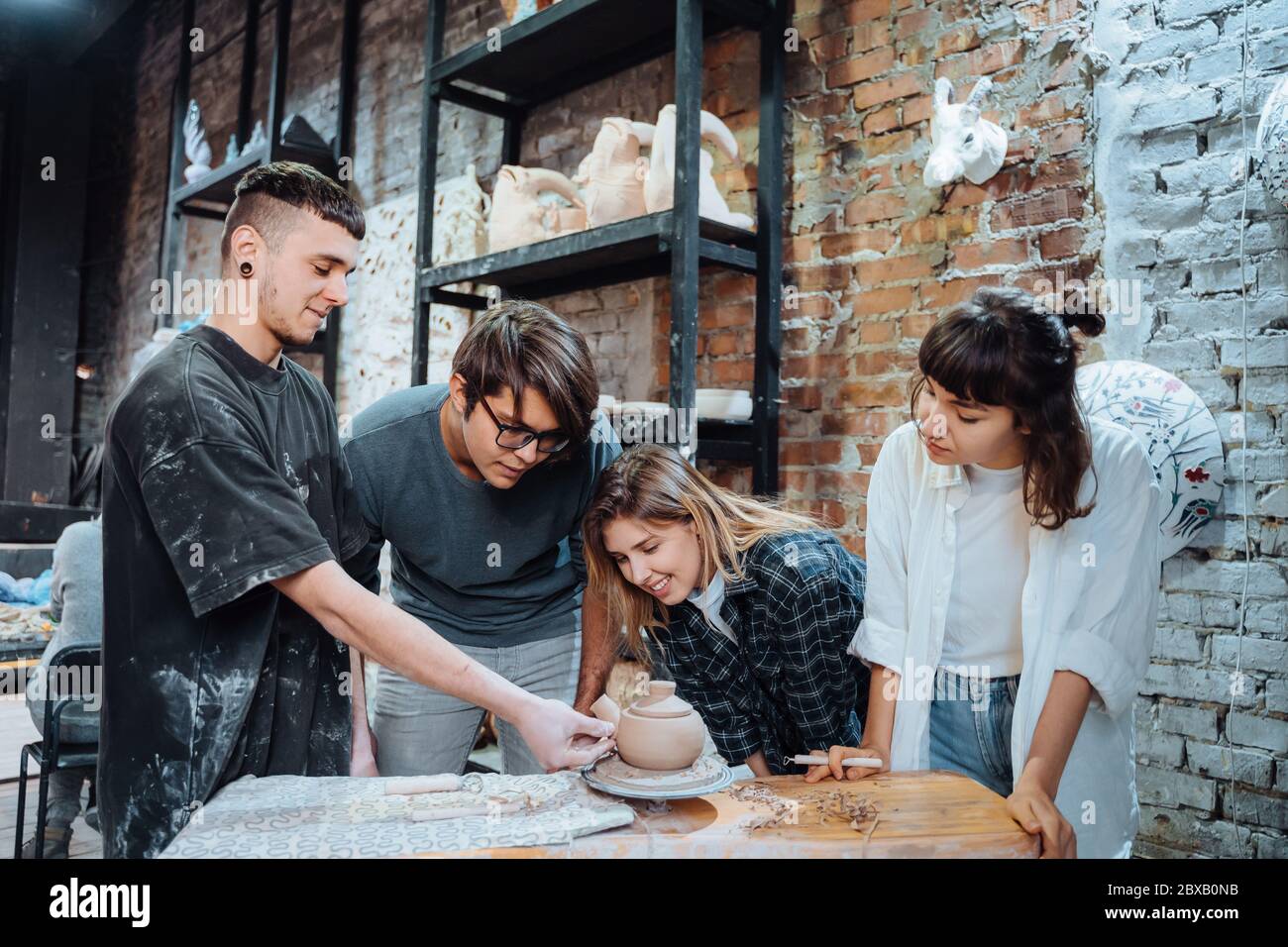 Making a handmade clay pot. Pottery lesson with master Stock Photo - Alamy