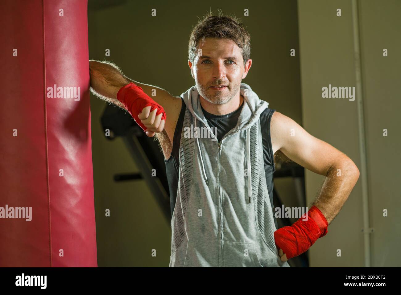 sport fitness lifestyle portrait of young happy and sweaty man boxing ...