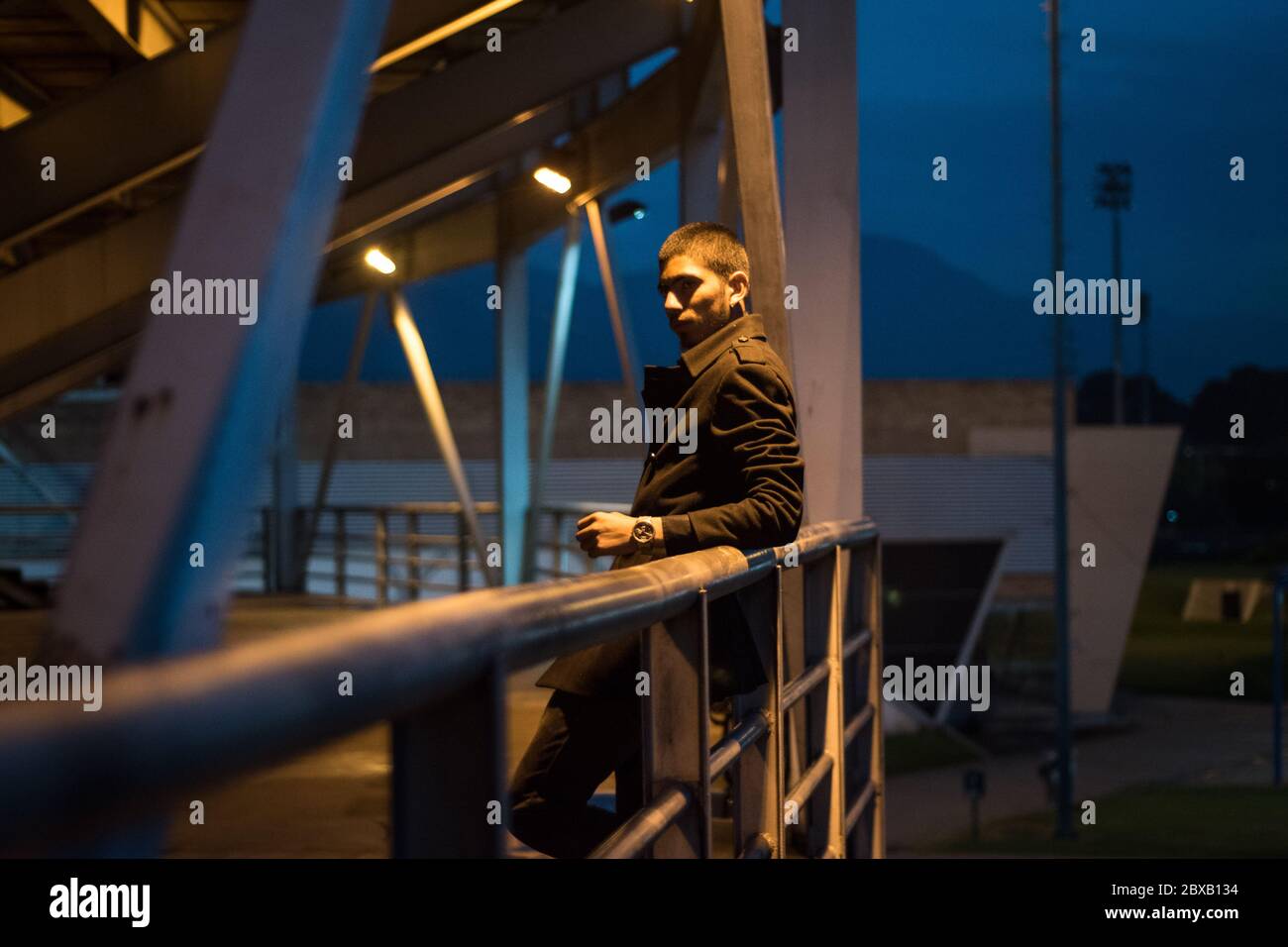 Portrait of a man posing at night Stock Photo - Alamy