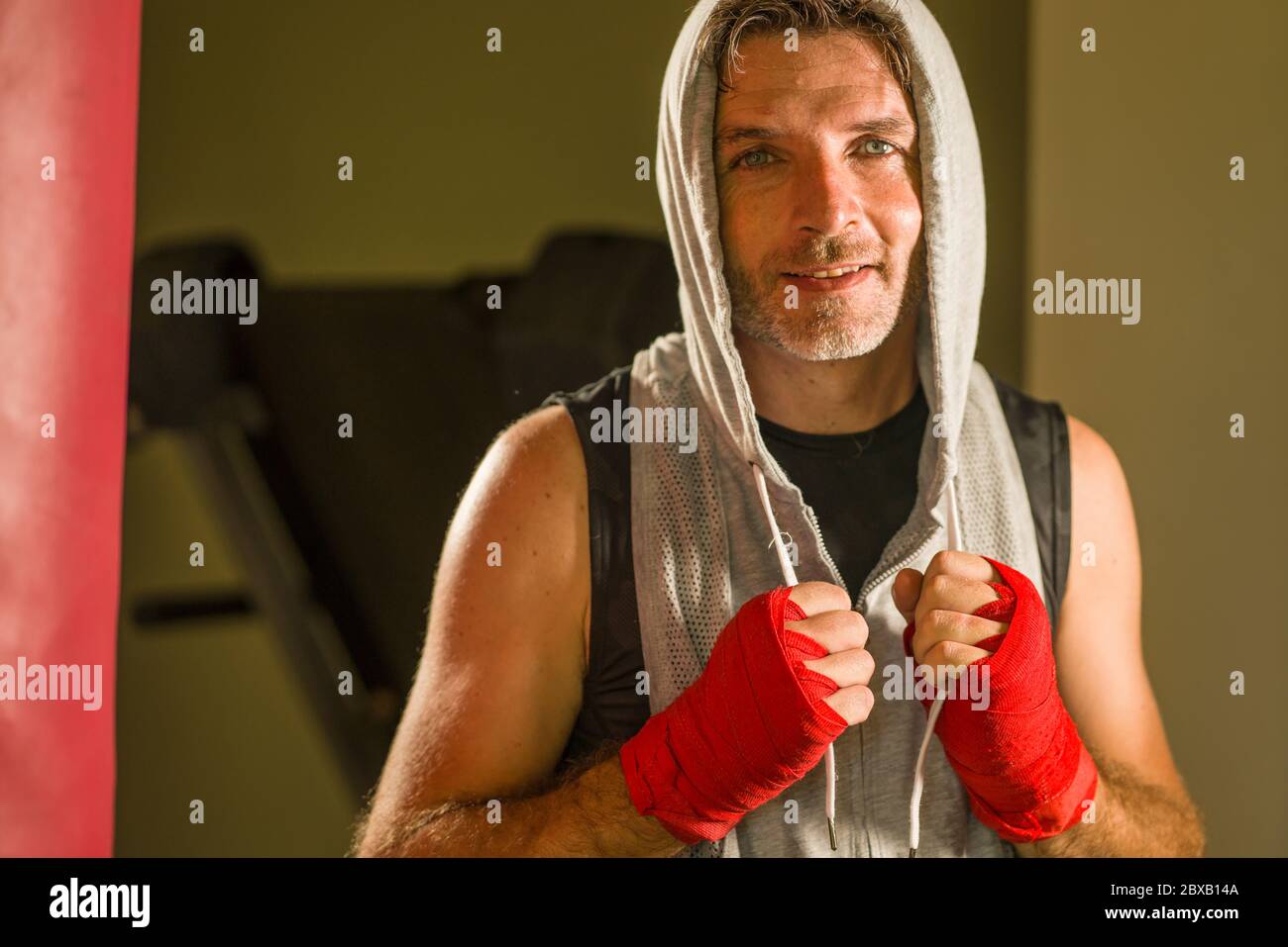 sport fitness lifestyle portrait of young happy and sweaty man boxing ...
