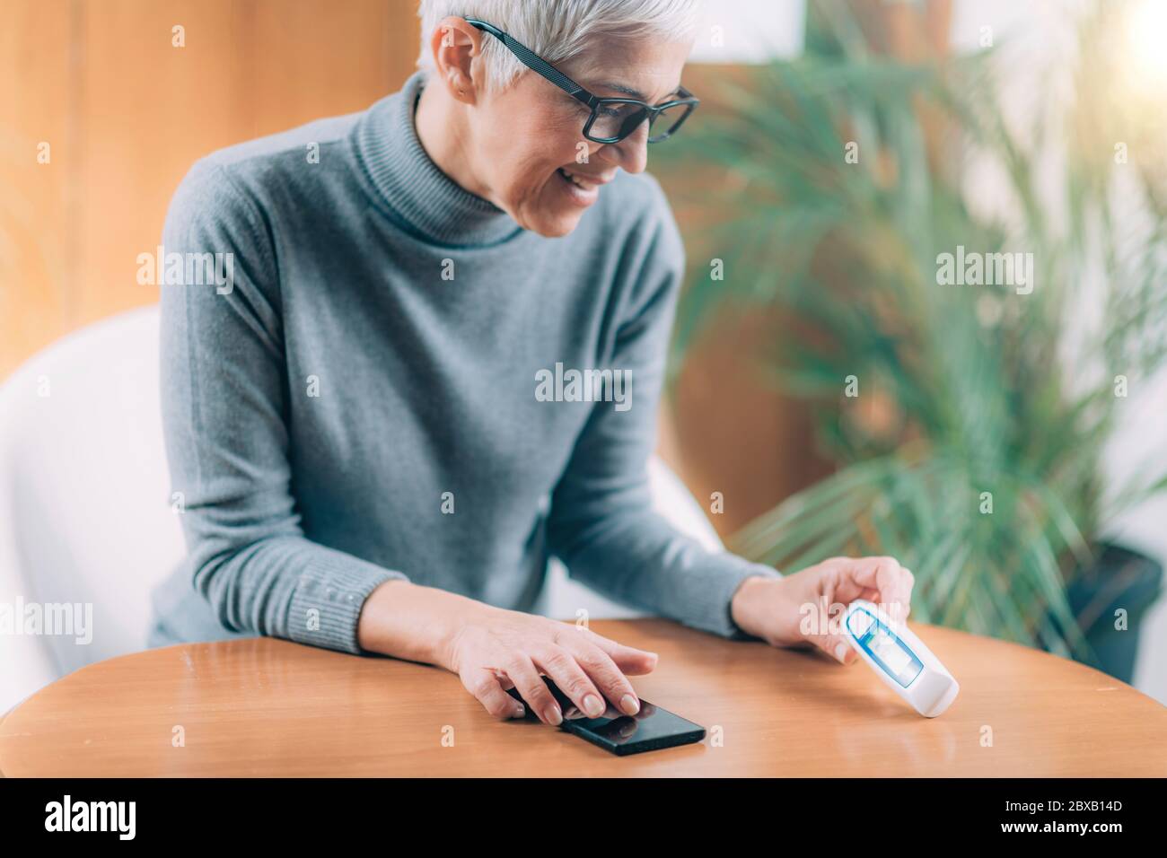 Senior woman measuring body hi-res stock photography and images - Alamy