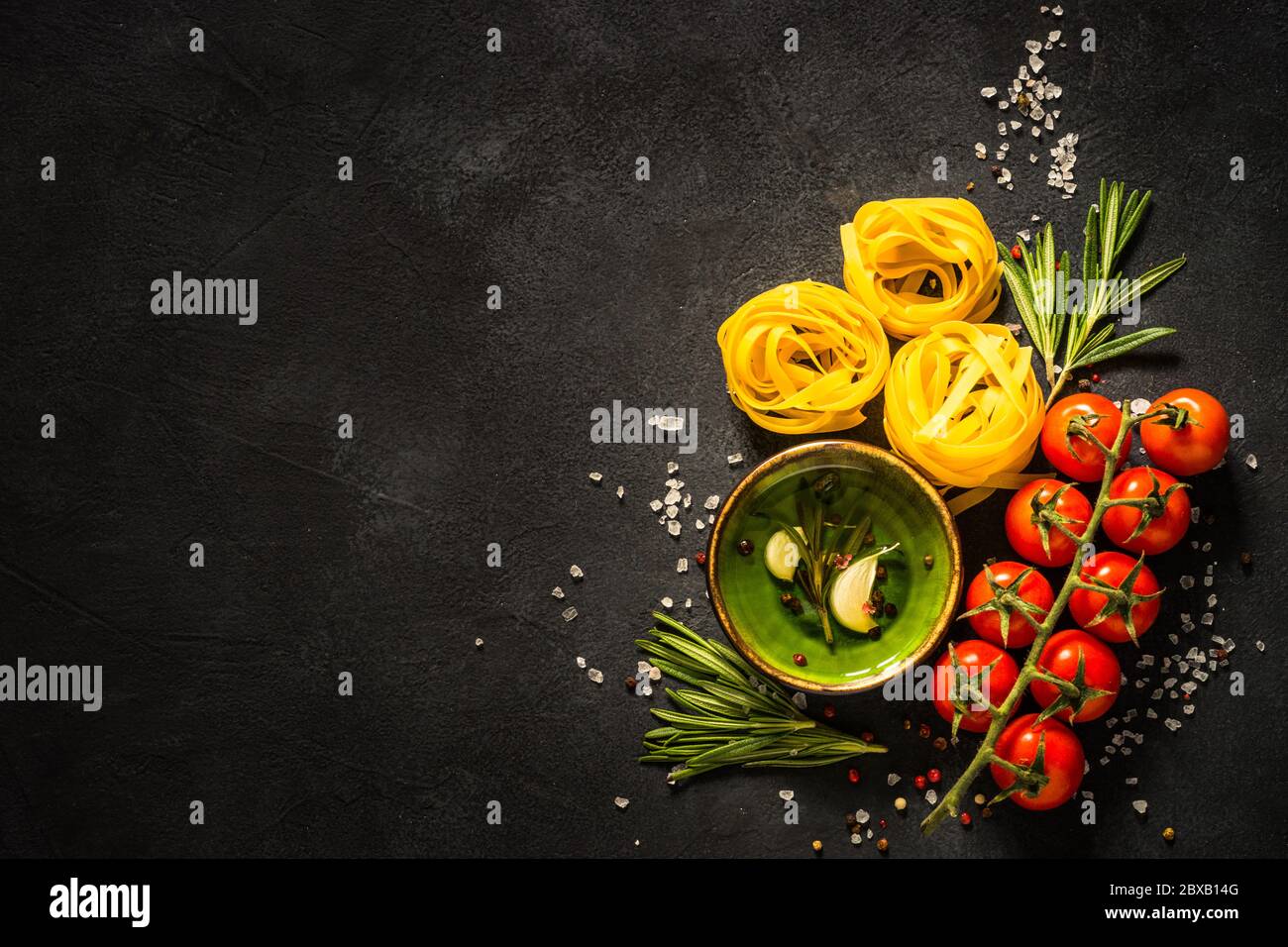 Food cooking background at black table top view Stock Photo - Alamy