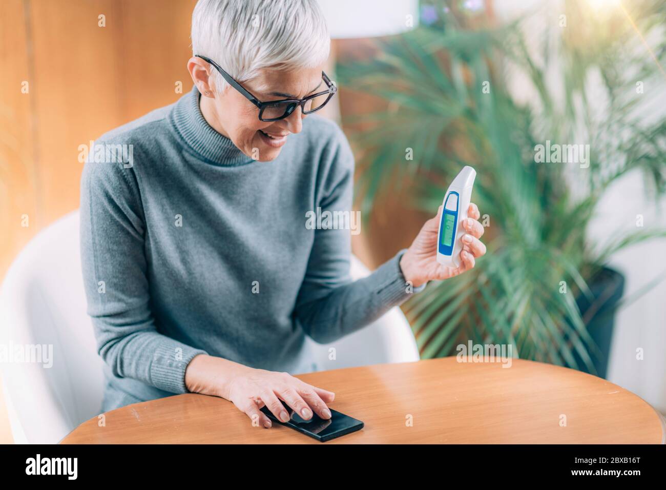 Senior woman measuring body hi-res stock photography and images - Alamy
