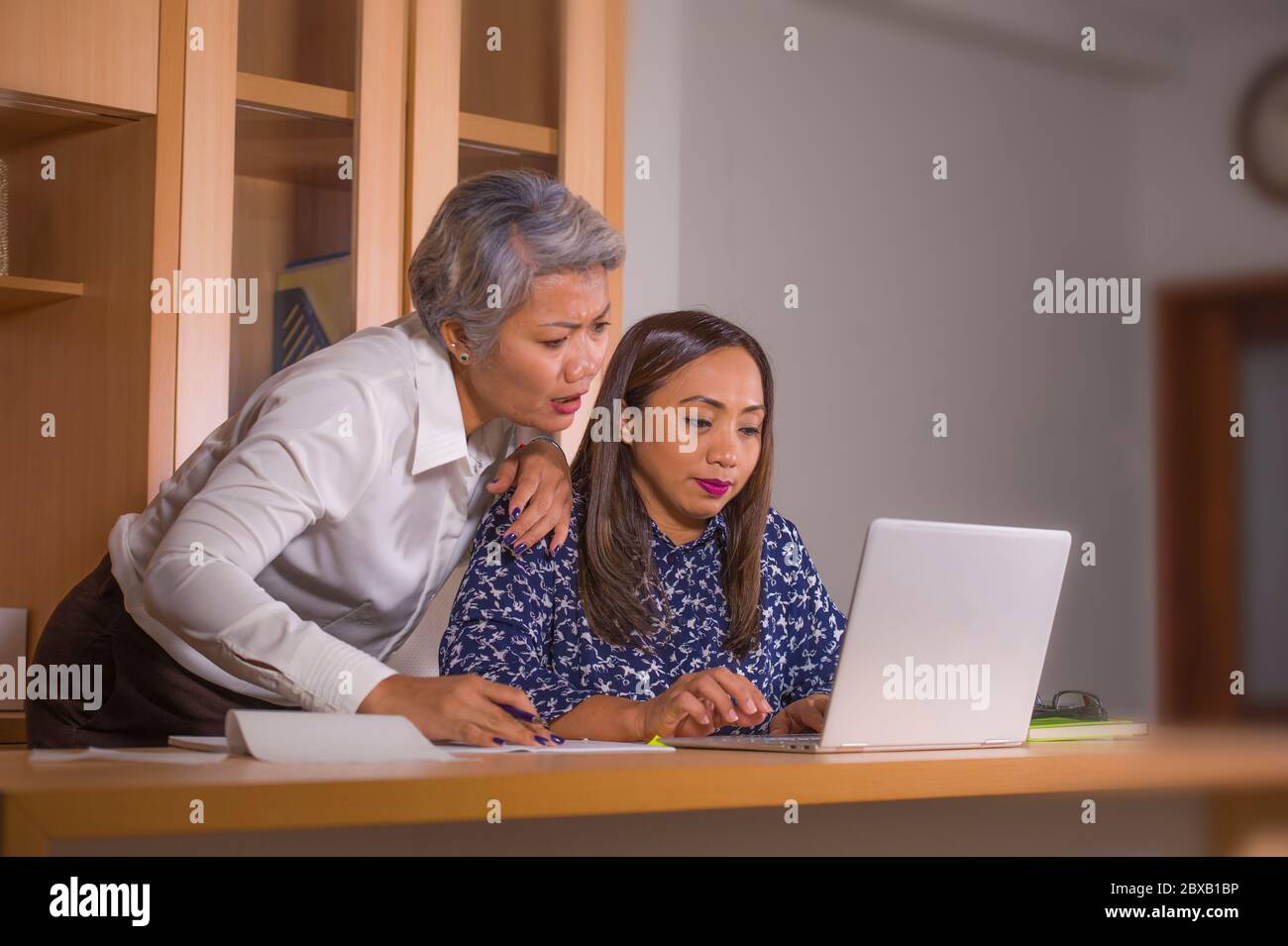 Executive Women coworking . Natural office lifestyle portrait of two ...