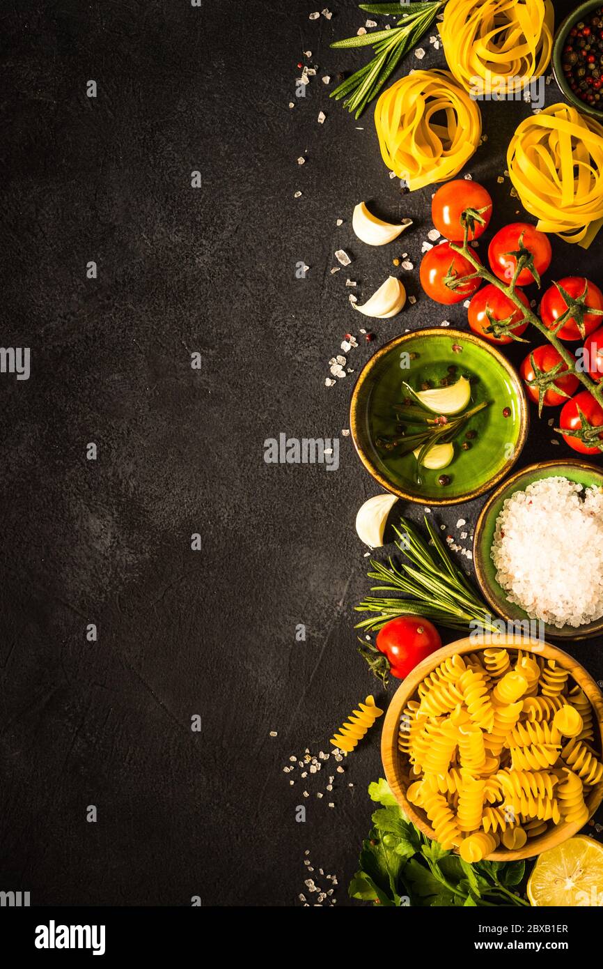 Food cooking background at black table top view Stock Photo - Alamy