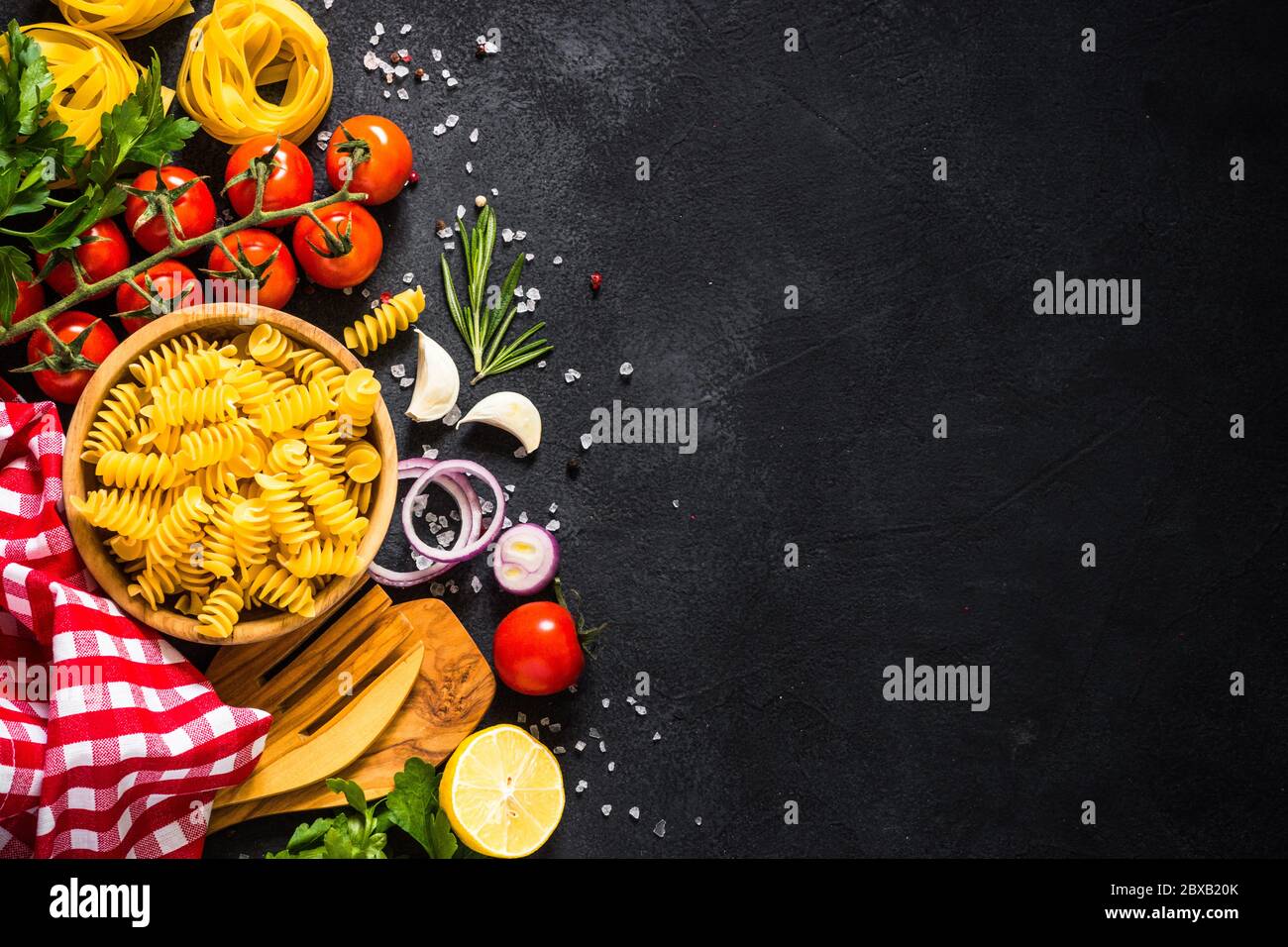 Food cooking background at black table top view Stock Photo - Alamy