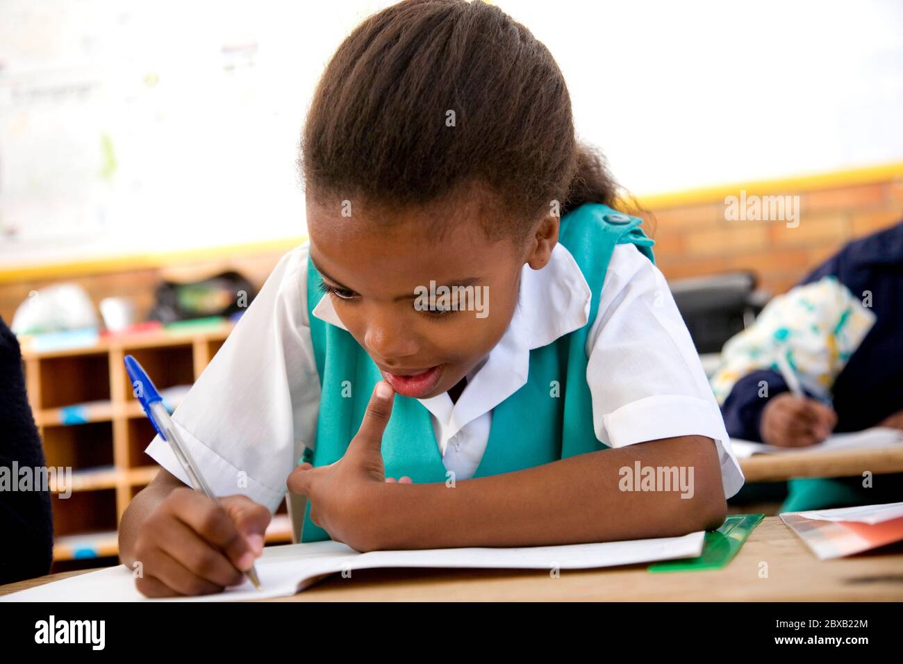Boy copying schoolwork Stock Photo - Alamy