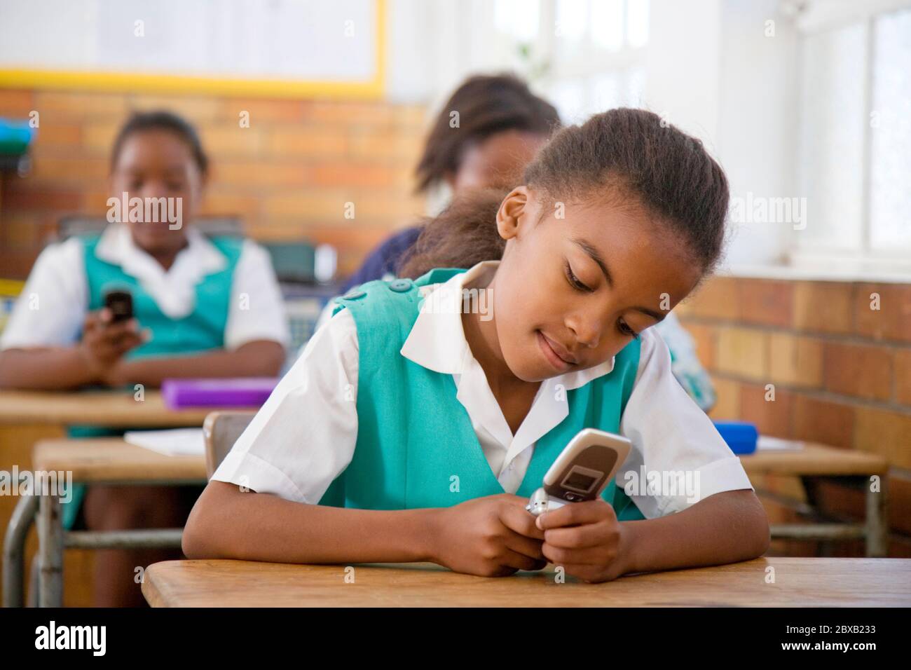 African school girl uniform using phone hi-res stock photography and ...