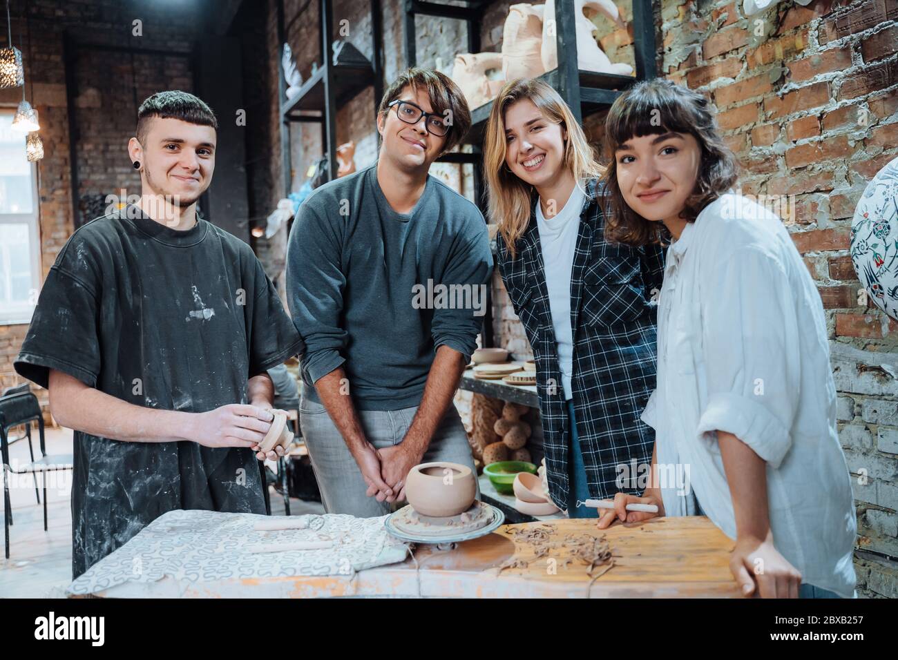 Making a handmade clay pot. Pottery lesson with master Stock Photo - Alamy