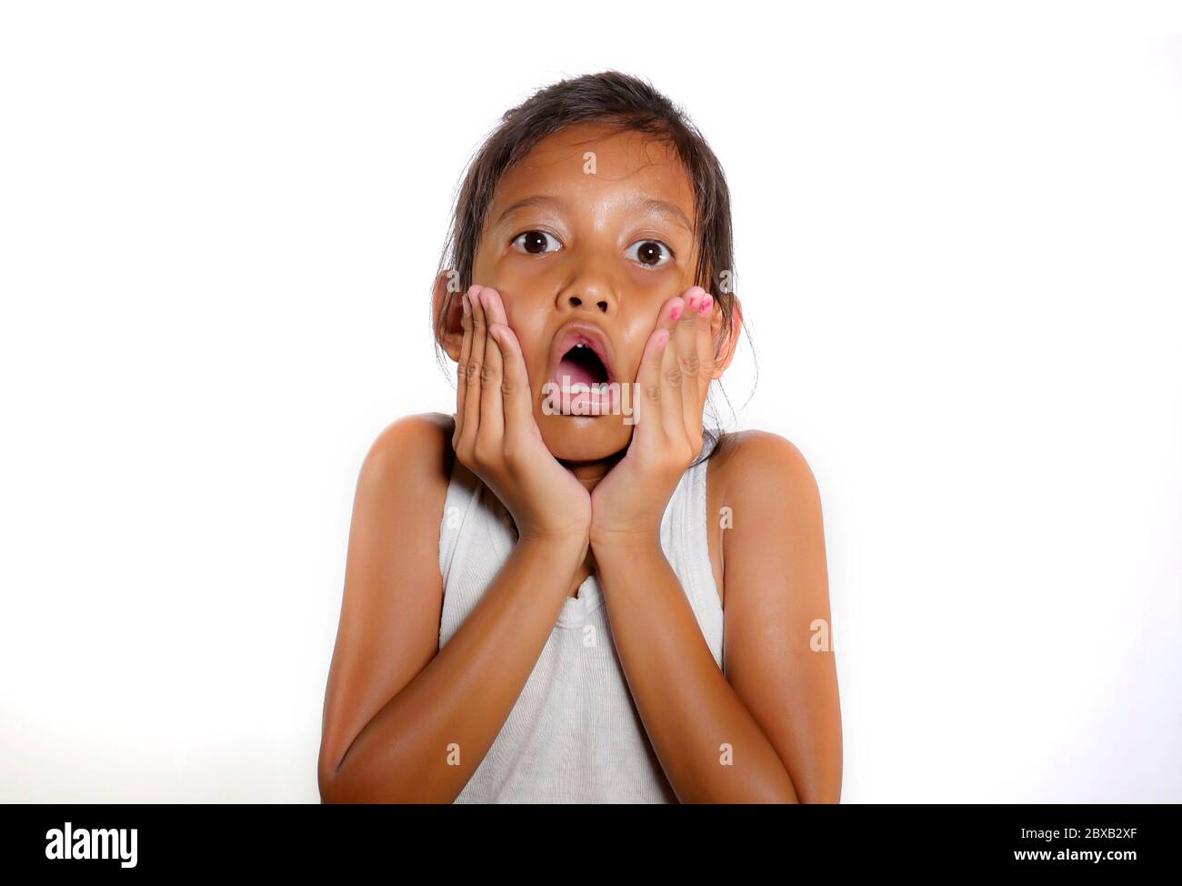 sweet and cute 7 or 8 years old female child shocked and surprised ...