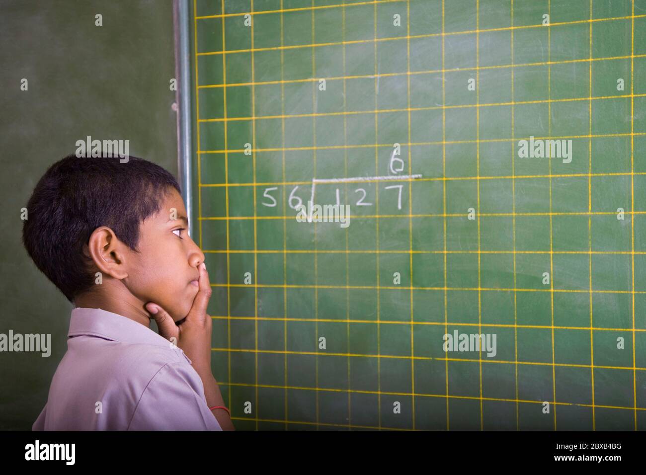 Boy solving math problem on hi-res stock photography and images - Alamy