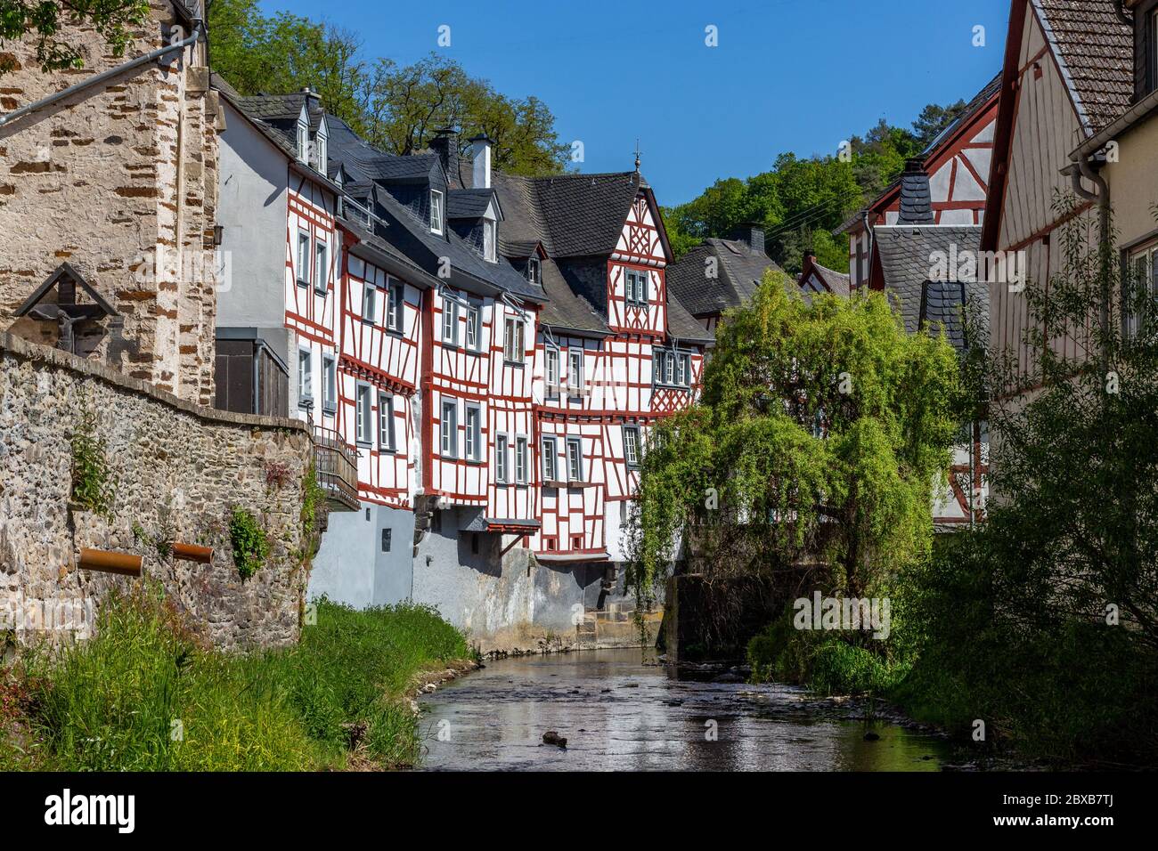 River elz with old bridge and half-timbered houses in Monreal, Germany ...