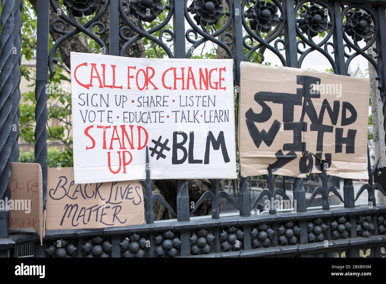 Placards are displayed on the Houses of Parliament railings during the ...