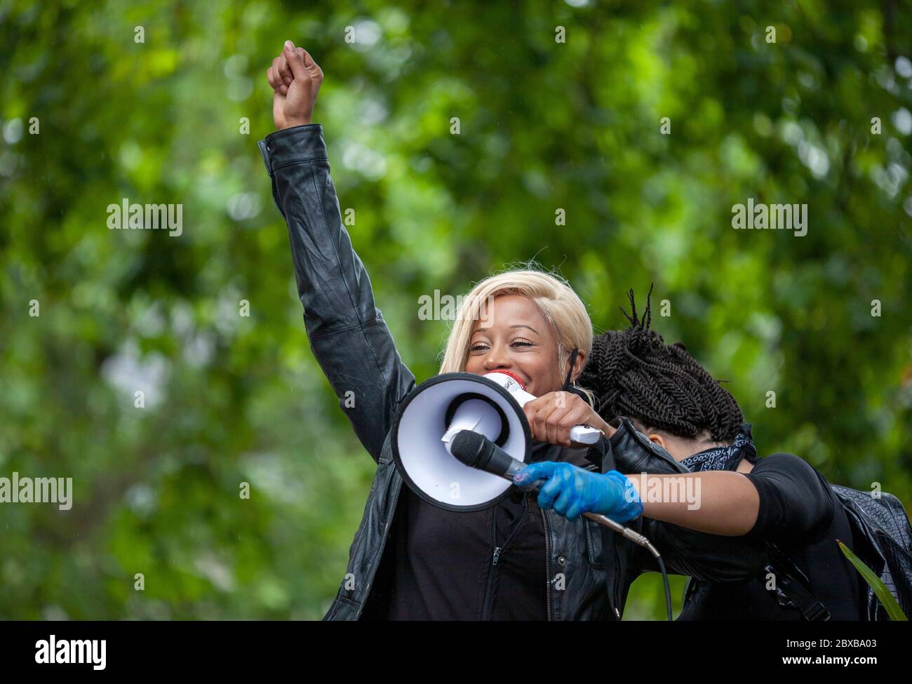 Actress, Imarn Ayton, speaking in to a tannoy loudspeaker and ...