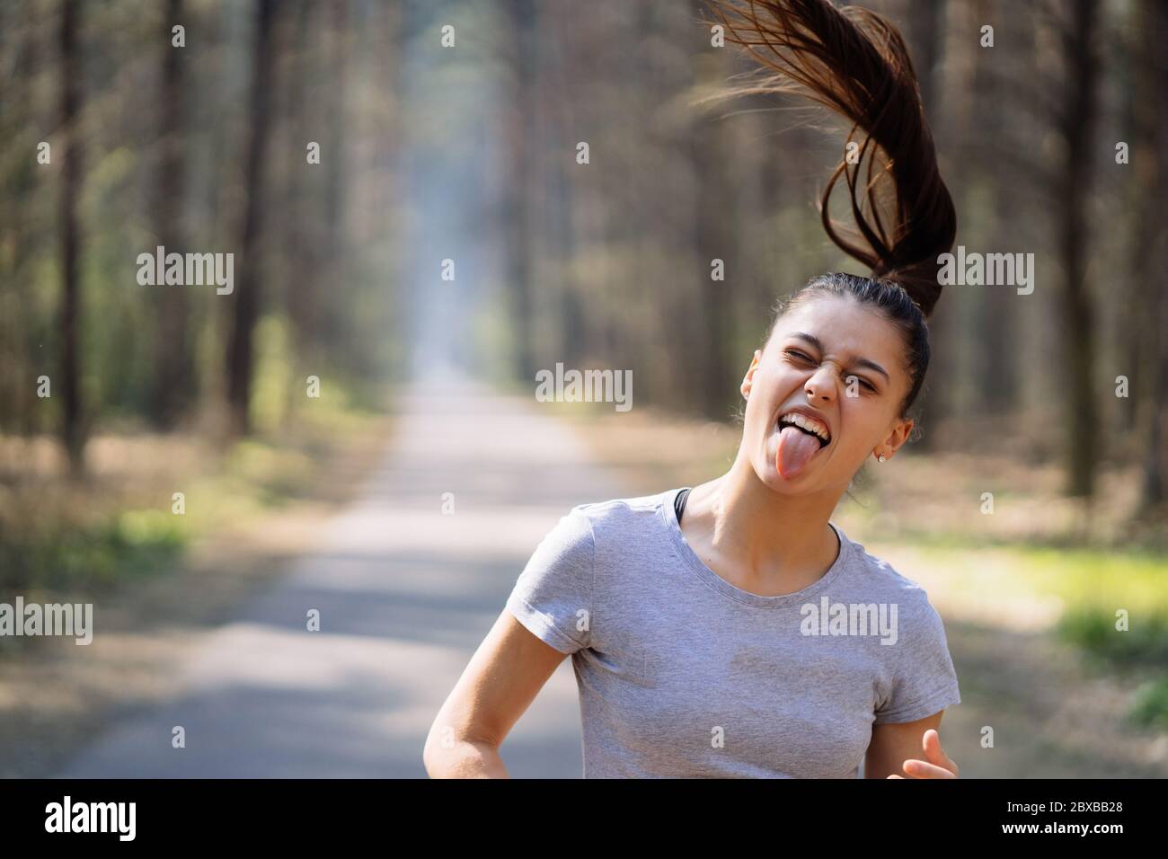 Beautiful teenage sport girl running on the grass active hi-res stock ...