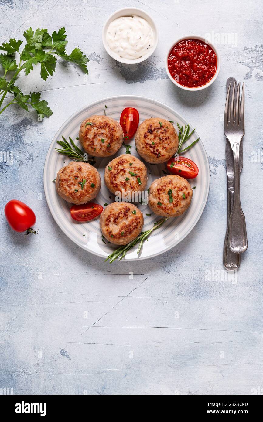 Fresh chiken cutlets with tomatoes and rosemary, top view Stock Photo ...