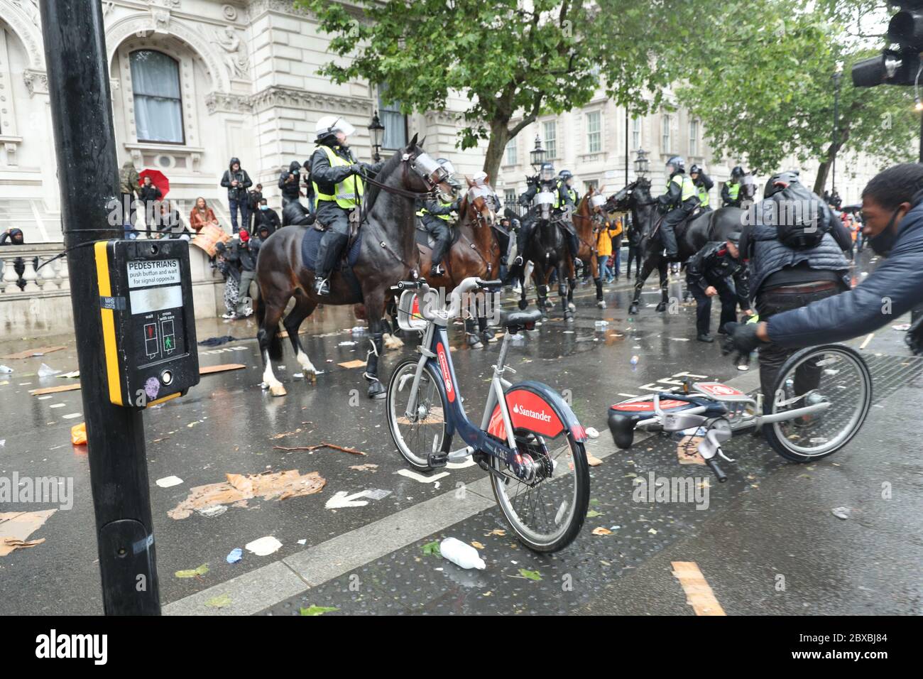 A bicycle is thrown at mounted police Police on horseback in Whitehall ...