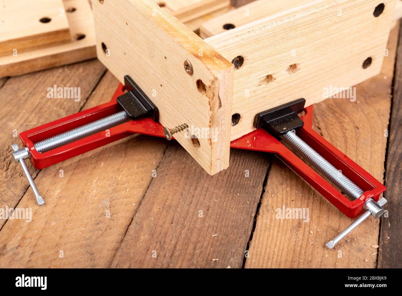 Joining wood using a carpentry clamp. Small carpentry work. Workplace ...