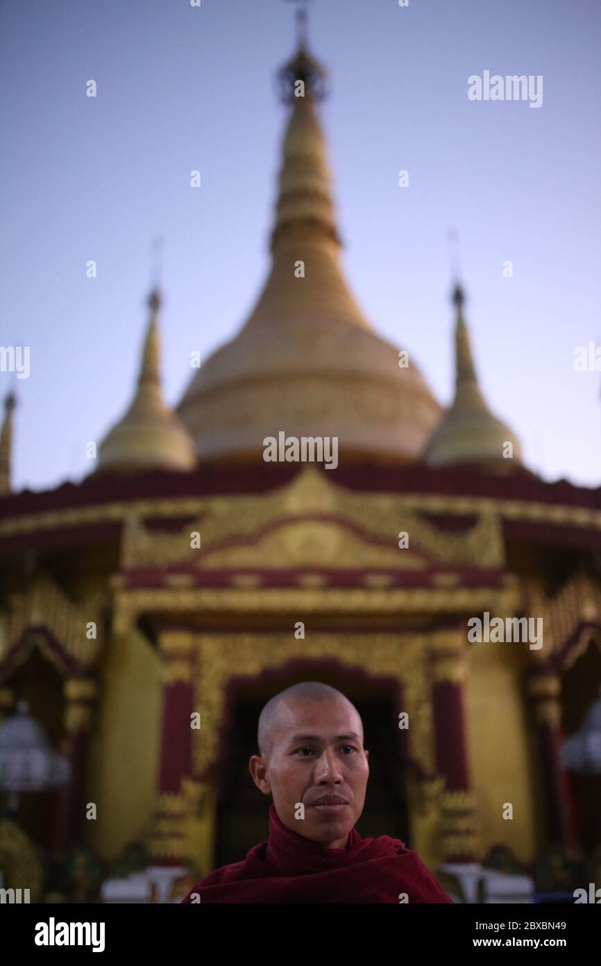 A Buddhist monk poses in front of a temple in Bandarban, Bangladesh on ...