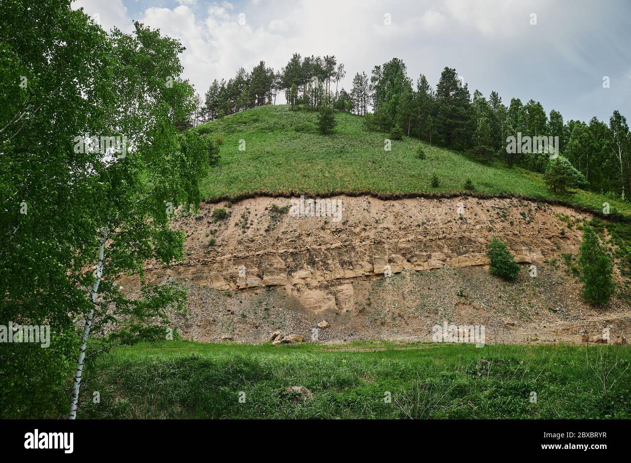 Layers of soil with groundwater. Details of earth layers in a clay pit ...