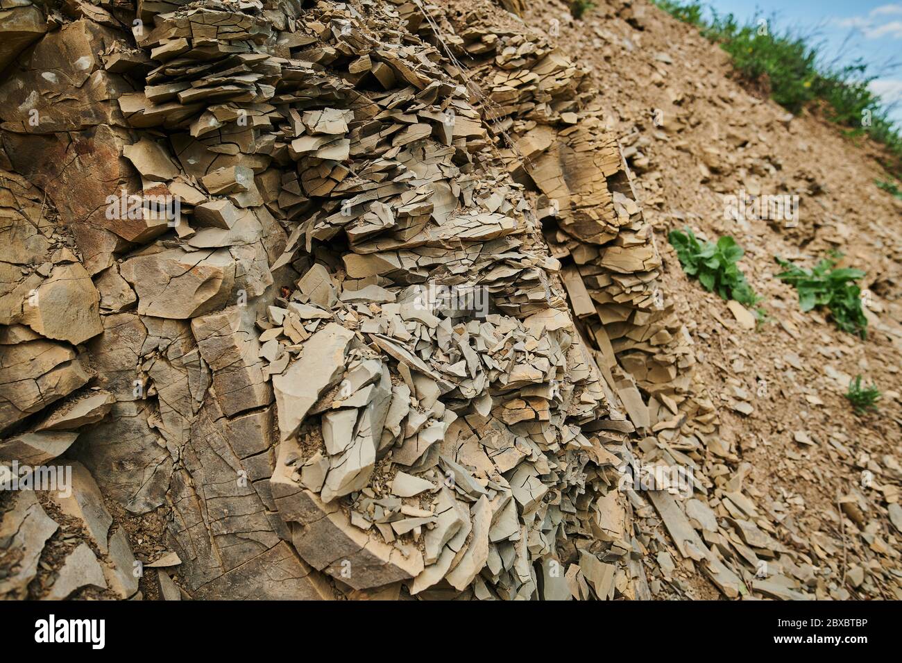 Layers of soil with groundwater. Details of earth layers in a clay pit ...